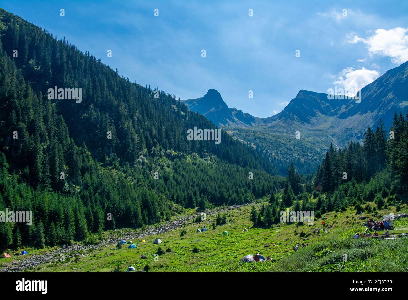 Beautiful shot of the Fagaras Mountains in Romania on a bright day ...