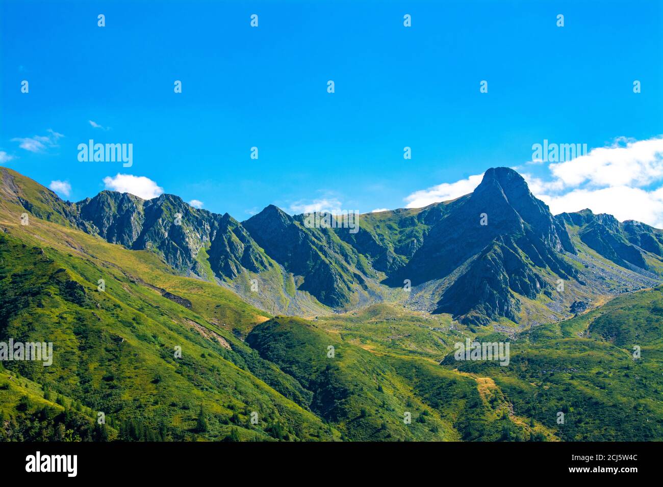 Beautiful shot of the Fagaras Mountains in Romania on a bright day ...