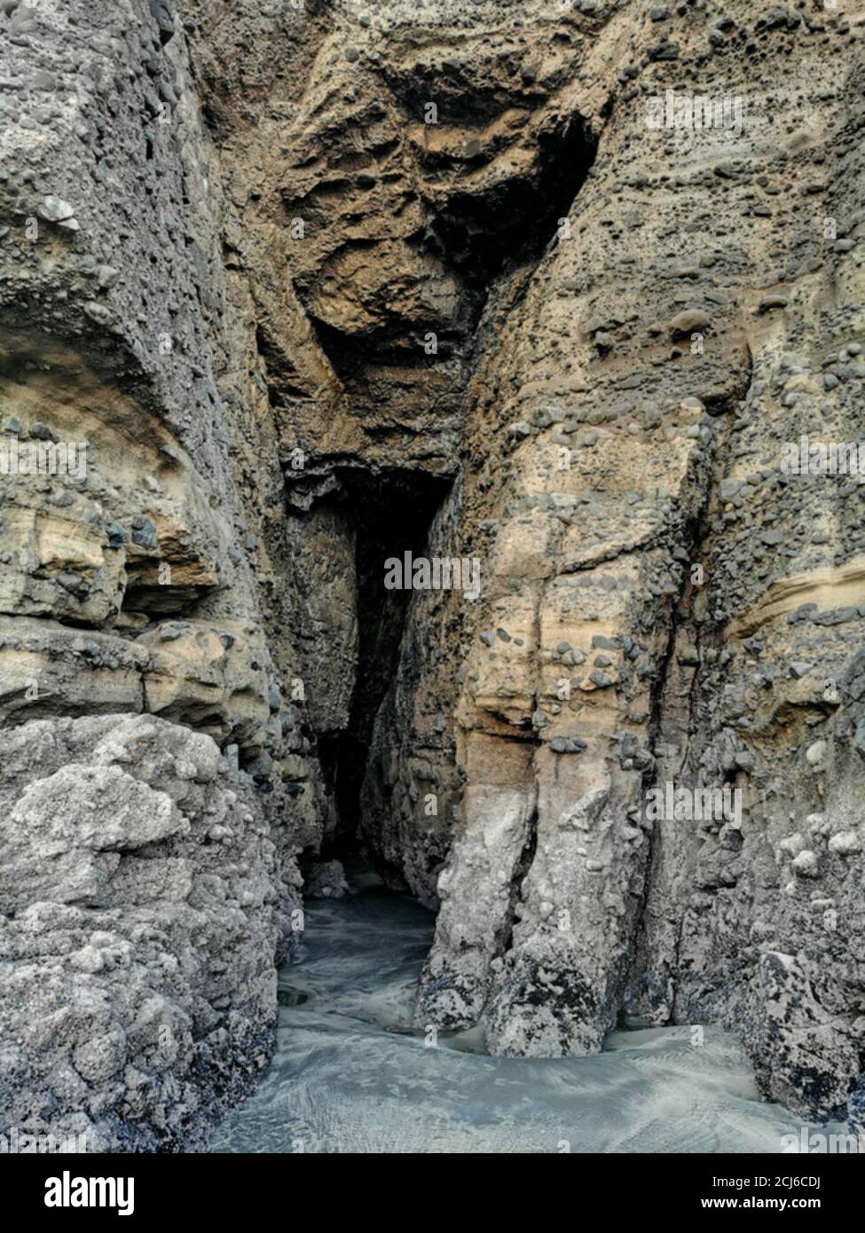 Beautiful shot of a Piha Blowhole cave Stock Photo - Alamy