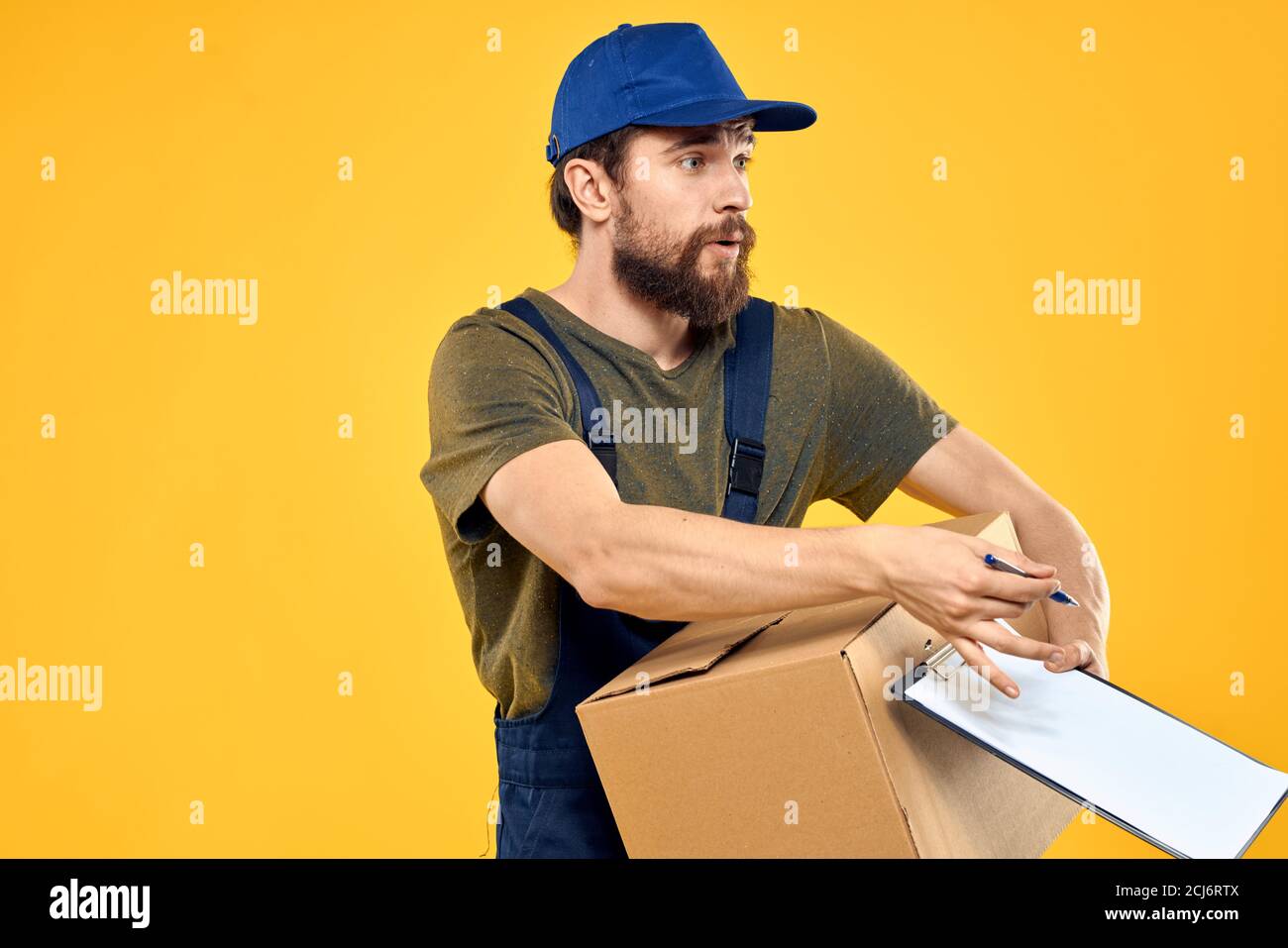 Worker male courier delivering boxes packaging documents yellow ...