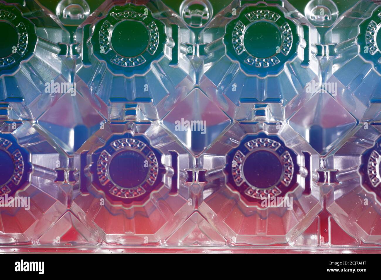 Closeup of an inverted plastic egg tray on a colorful background Stock ...