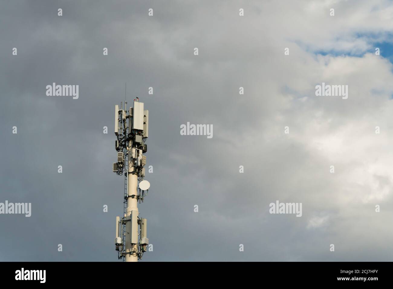RF Communication tranmission towers under cloudy sky Stock Photo - Alamy