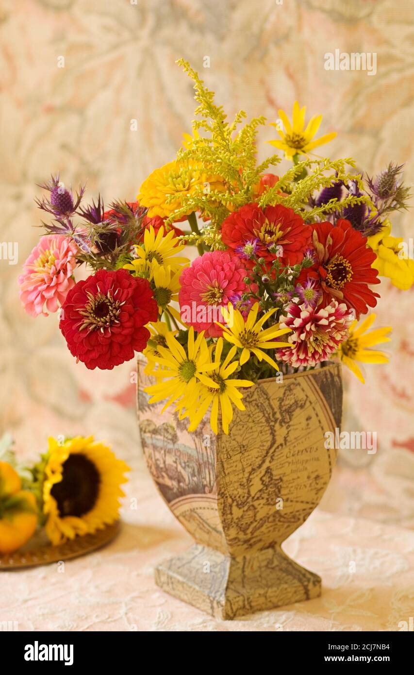 Autumn floral arrangement in a world map vase Stock Photo - Alamy