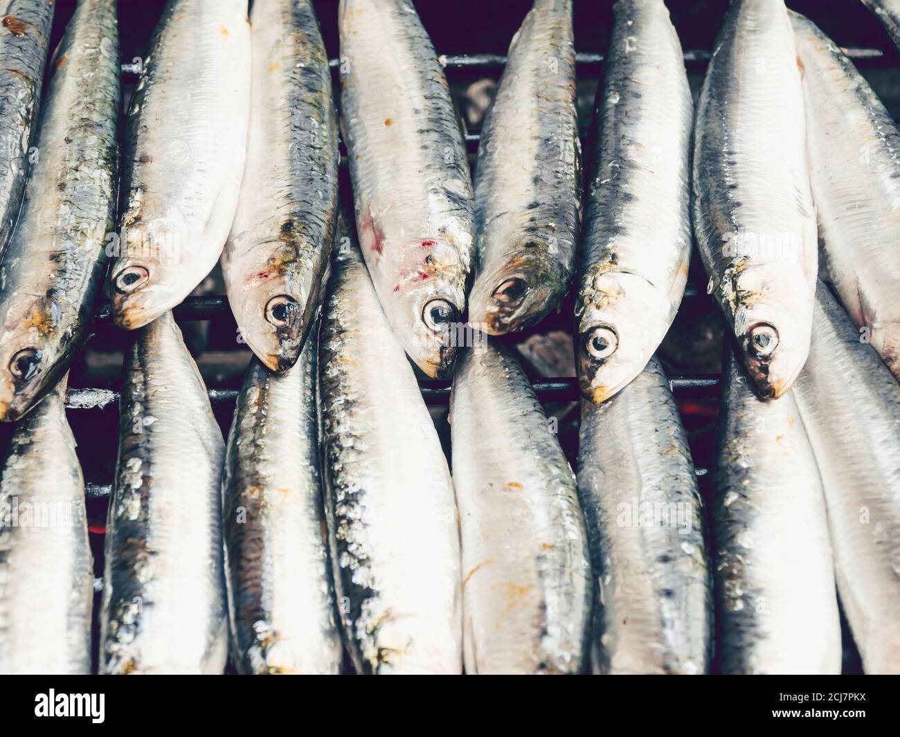 Top view of a sardines grilling process Stock Photo - Alamy
