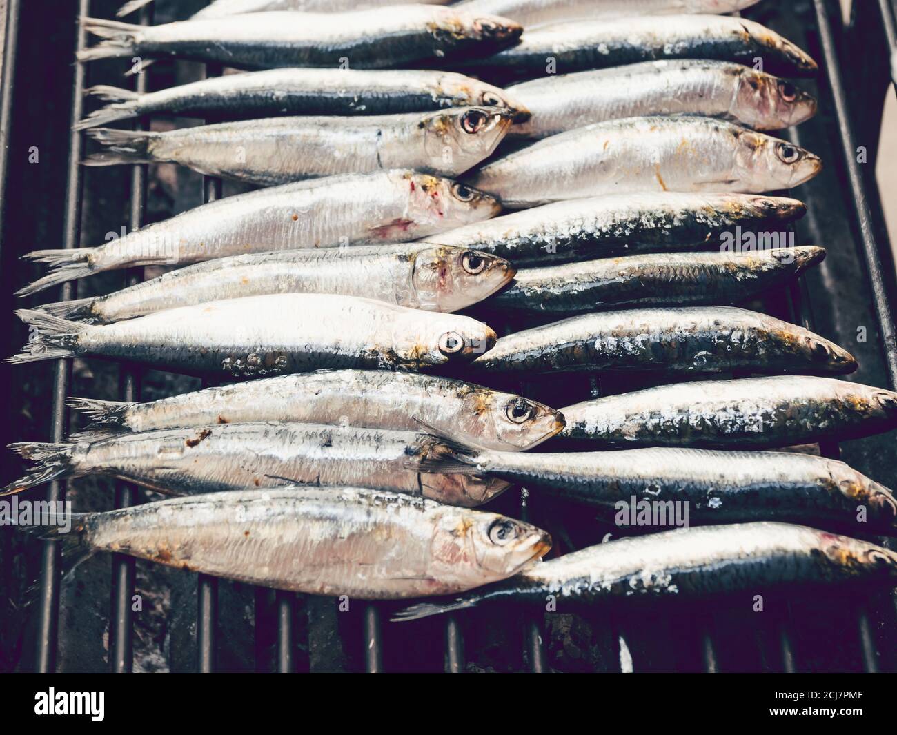Top view of a sardines grilling process Stock Photo - Alamy