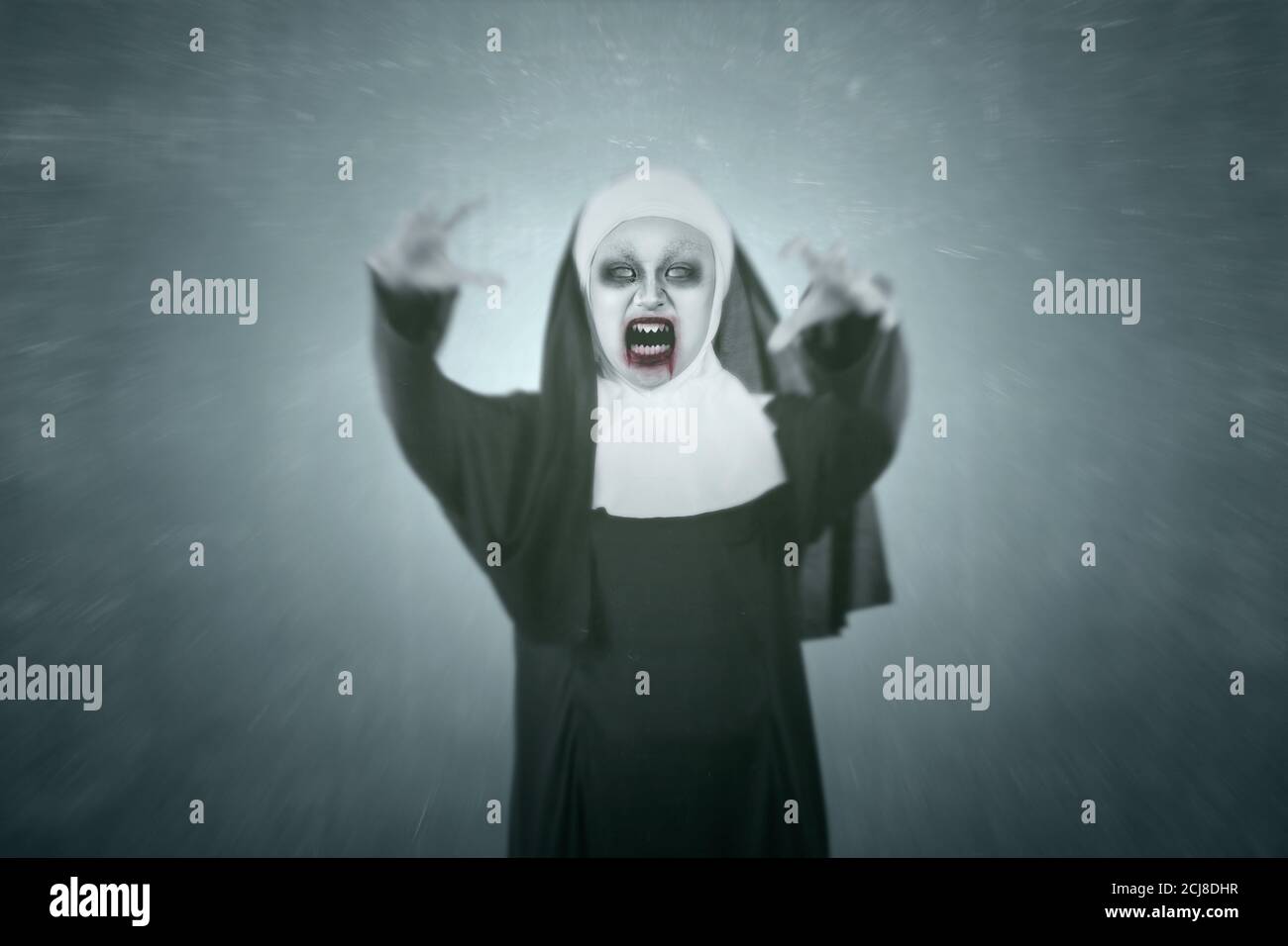 Scary devil nun standing with the black wall background Stock Photo - Alamy