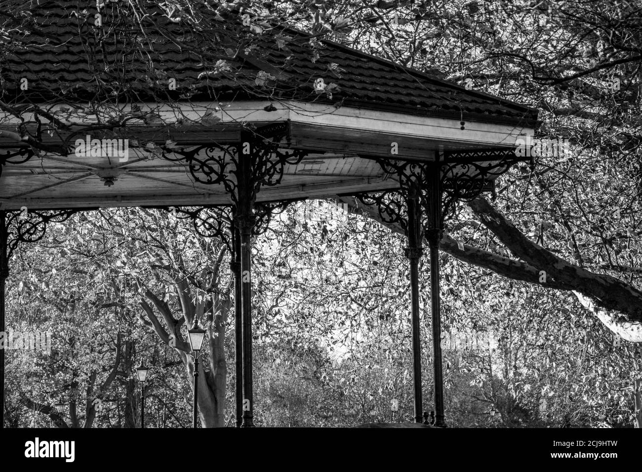 Greyscale shot of a pavilion in a garden in string Stock Photo - Alamy