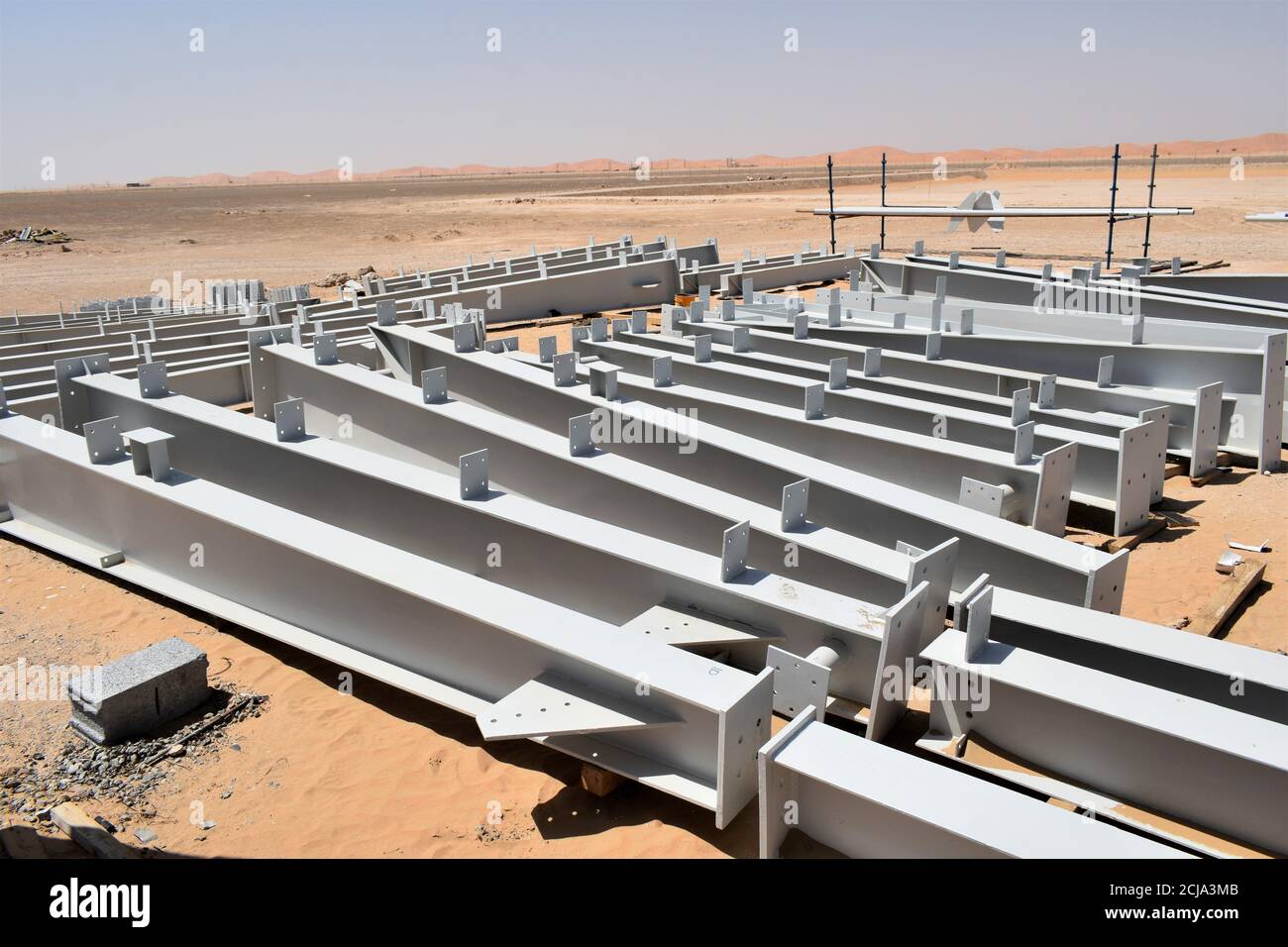 White painted steel structures on the desert ground Stock Photo - Alamy