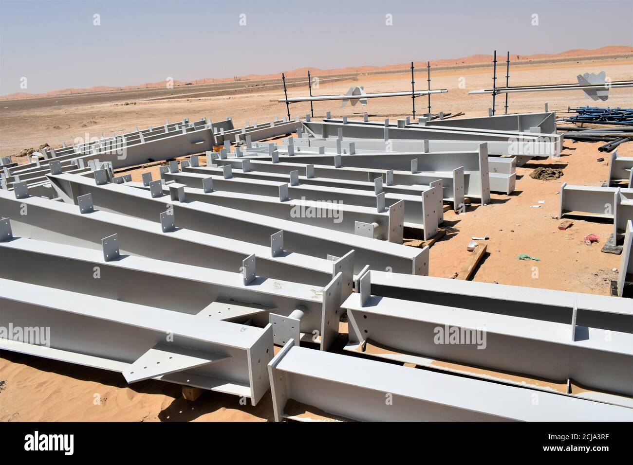 White painted steel structures on the desert ground Stock Photo - Alamy