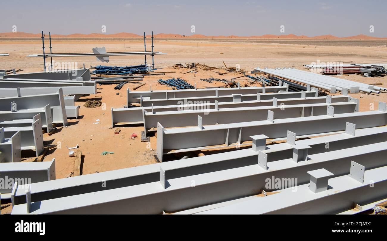 White painted steel structures on the desert ground Stock Photo - Alamy