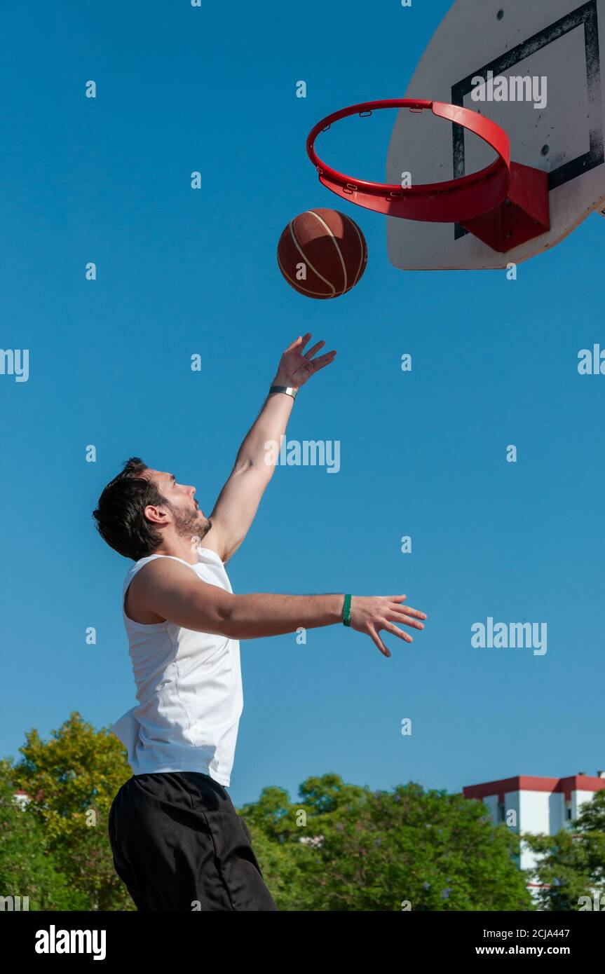 Vertical shot of an athletic man playing basketball Stock Photo - Alamy