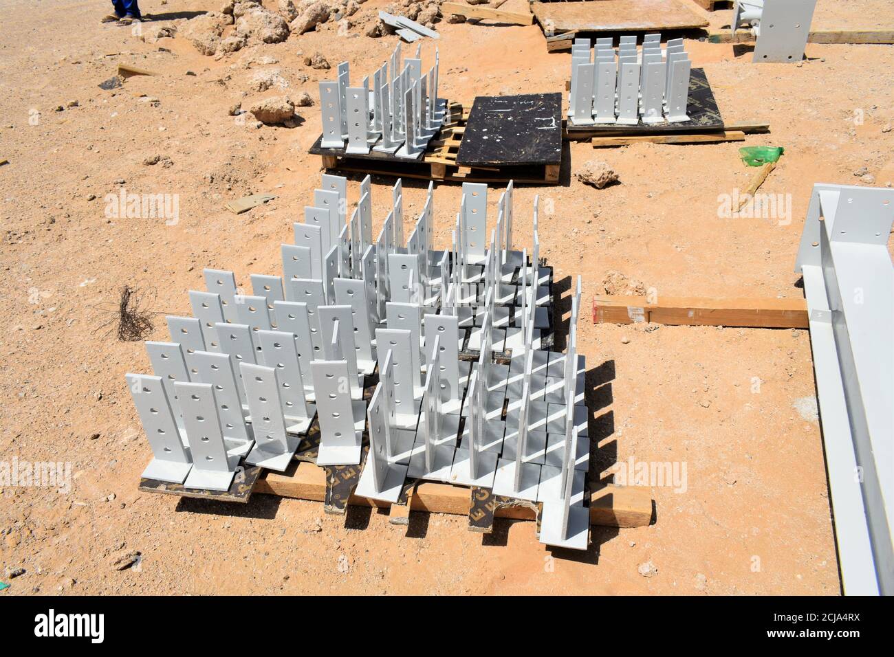 White painted steel structures on the desert ground Stock Photo - Alamy