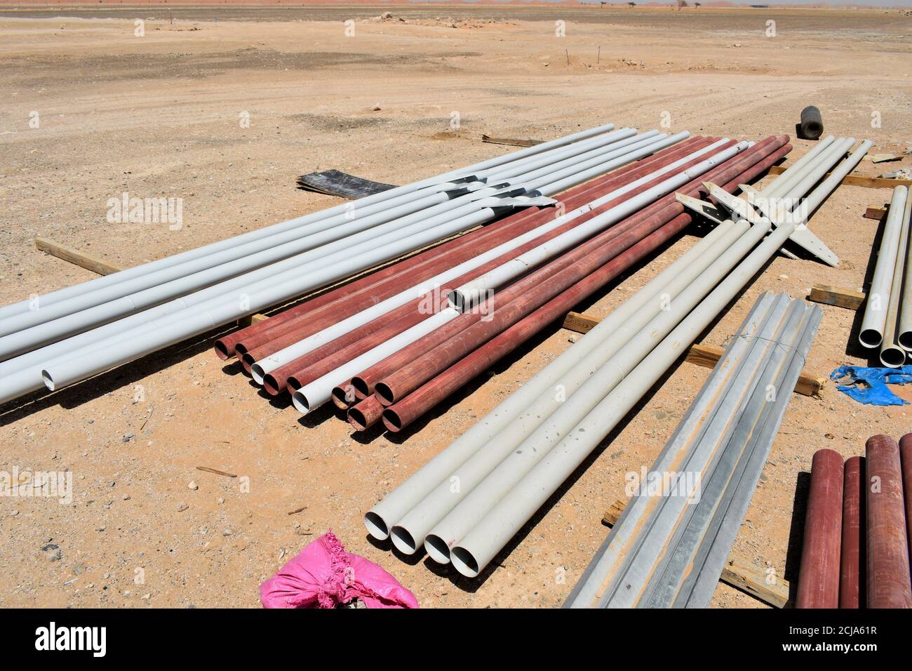 White painted steel structures on the desert ground Stock Photo - Alamy