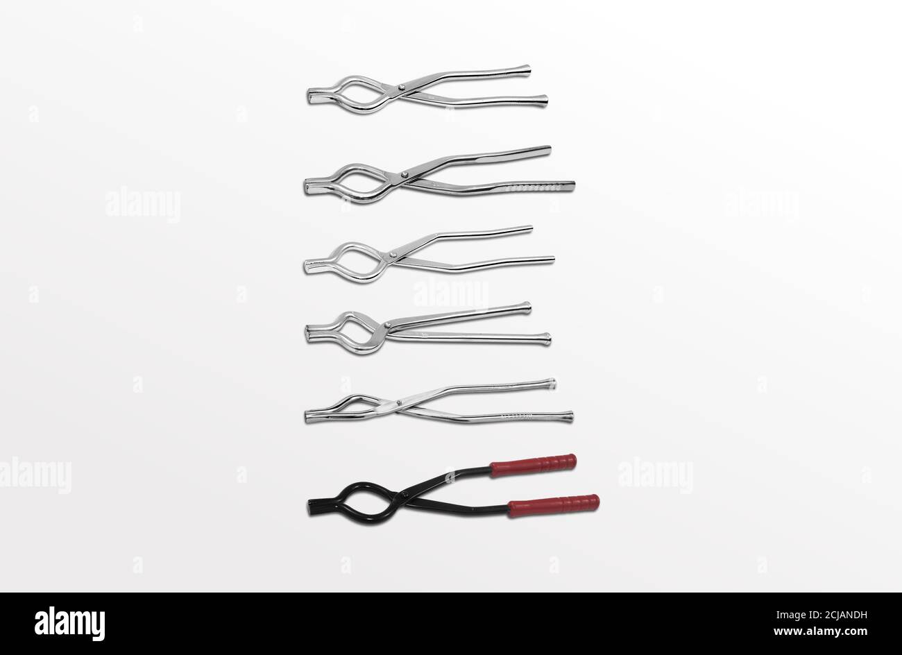 kitchen pincer, A stainless steel kitchen pincer placed upright against ...