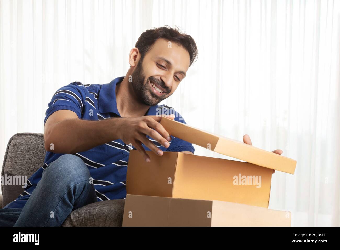 Man unboxing hi-res stock photography and images - Alamy