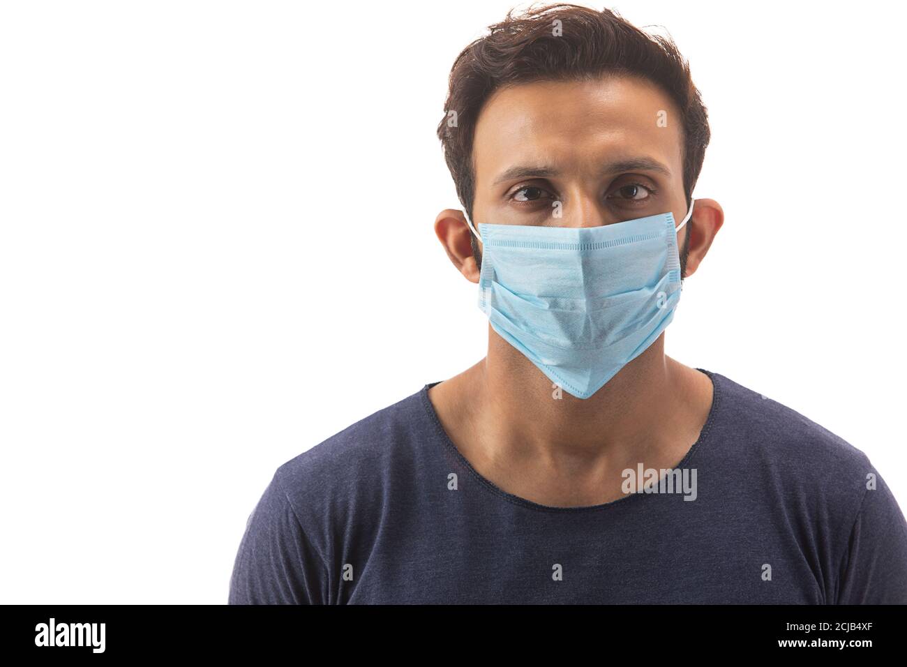 Young man with his face covered in a mask protecting himself from ...