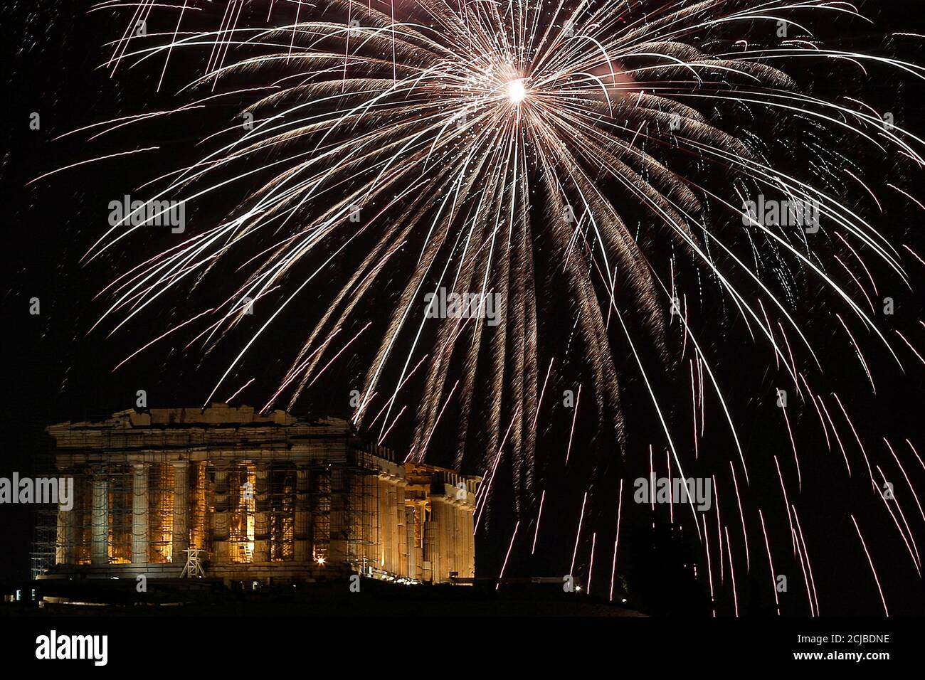 Fireworks explode over the ancient parthenon temple at the acropolis hi ...