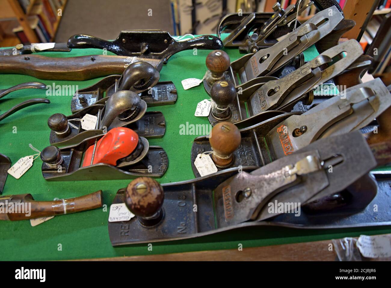 A display of vintage carpenters woodworking planes in an antiques ...