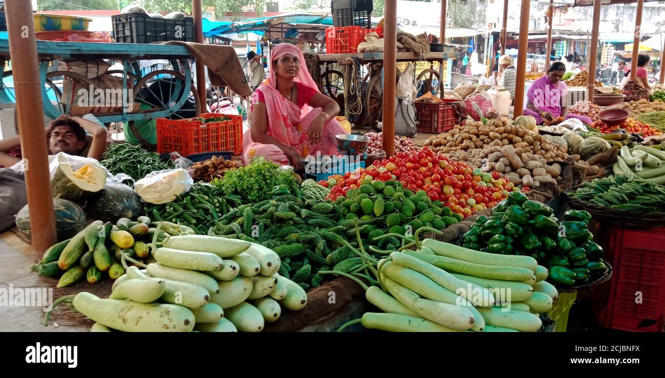 DISTRICT KATNI, INDIA - AUGUST 14, 2019: Asian village people selling ...