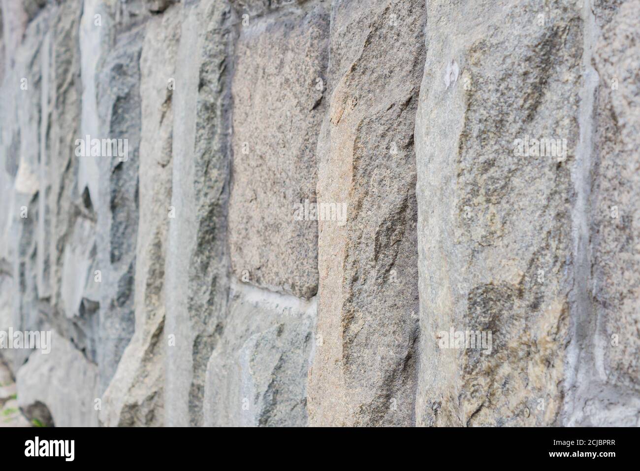 granite stone wall. Perspective background texture Stock Photo - Alamy