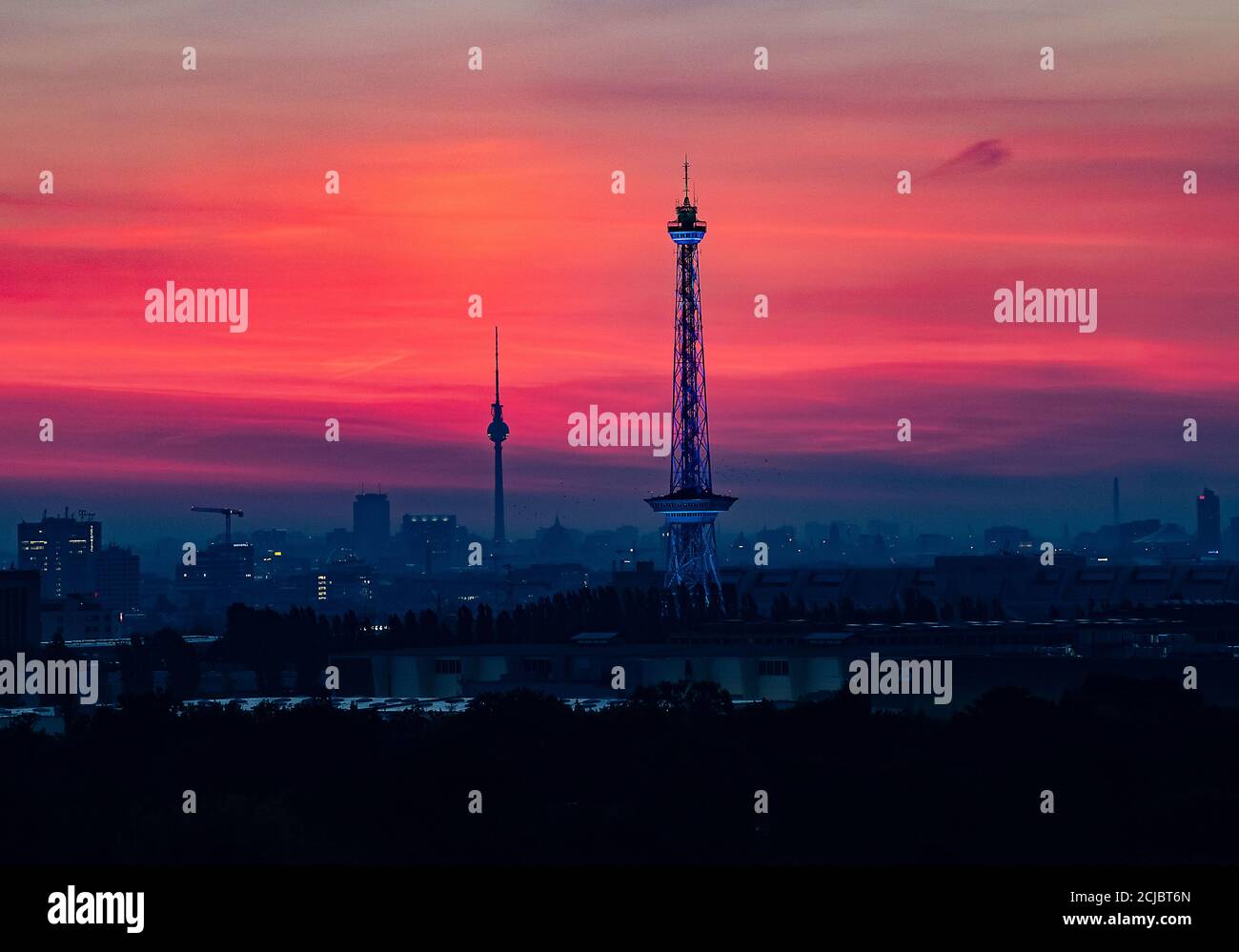 Berlin, Germany. 15th Sep, 2020. The rising sun colours the sky above ...