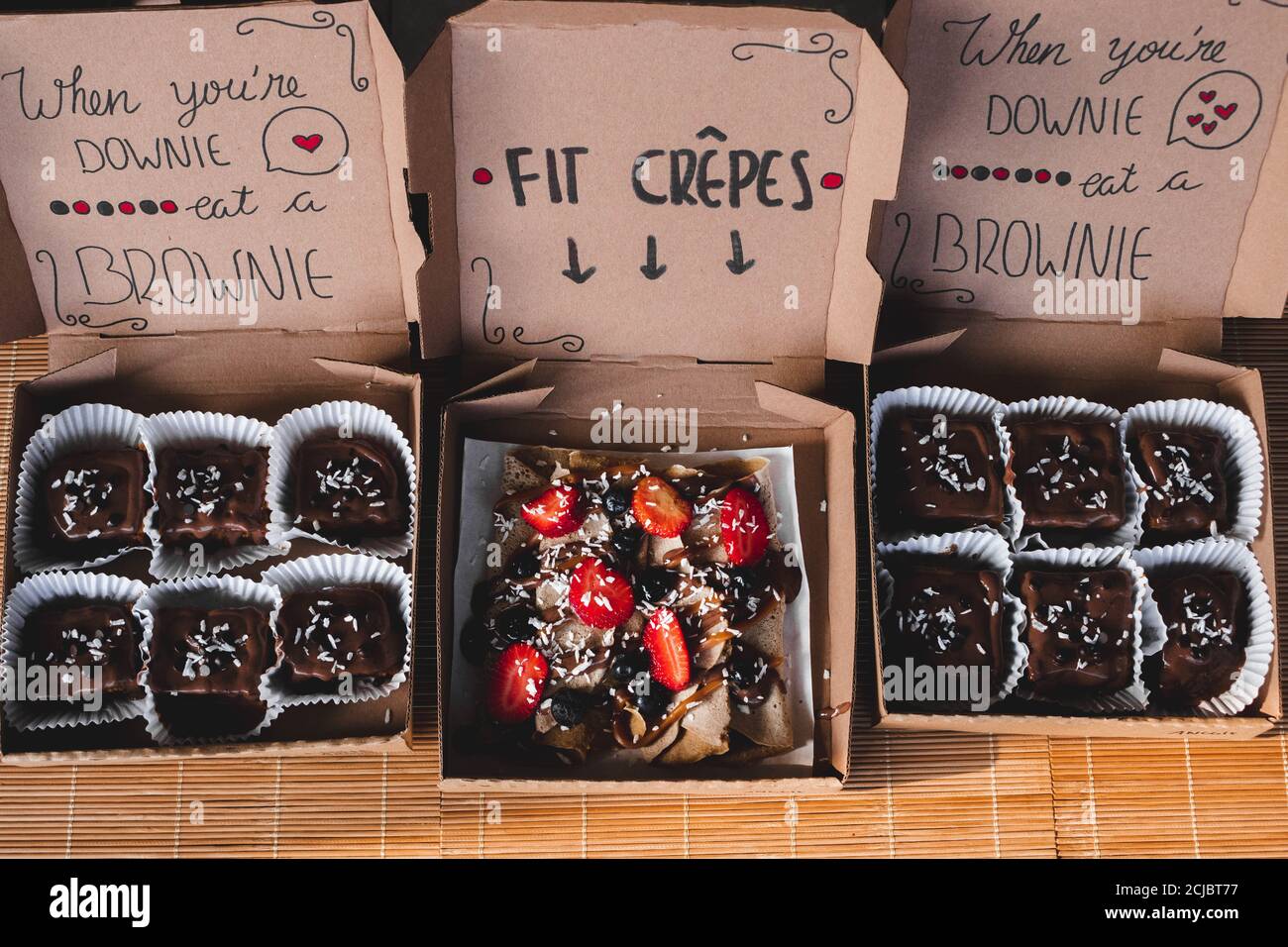 Top view of takeaway food boxes with pastry and cute inscriptions Stock ...