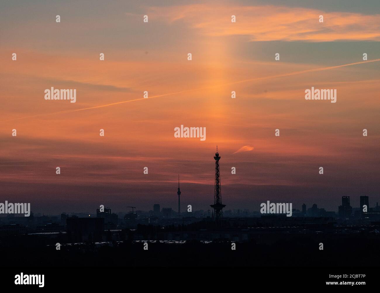 Berlin, Germany. 15th Sep, 2020. The rising sun colours the sky above ...