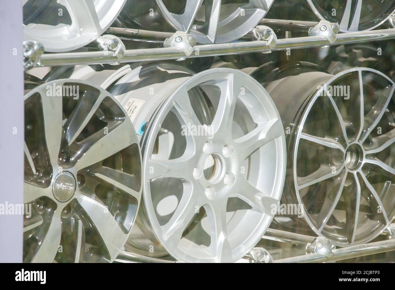 Russia Vyborg. 09.09.2020 Car rims in the shop window behind the glass ...