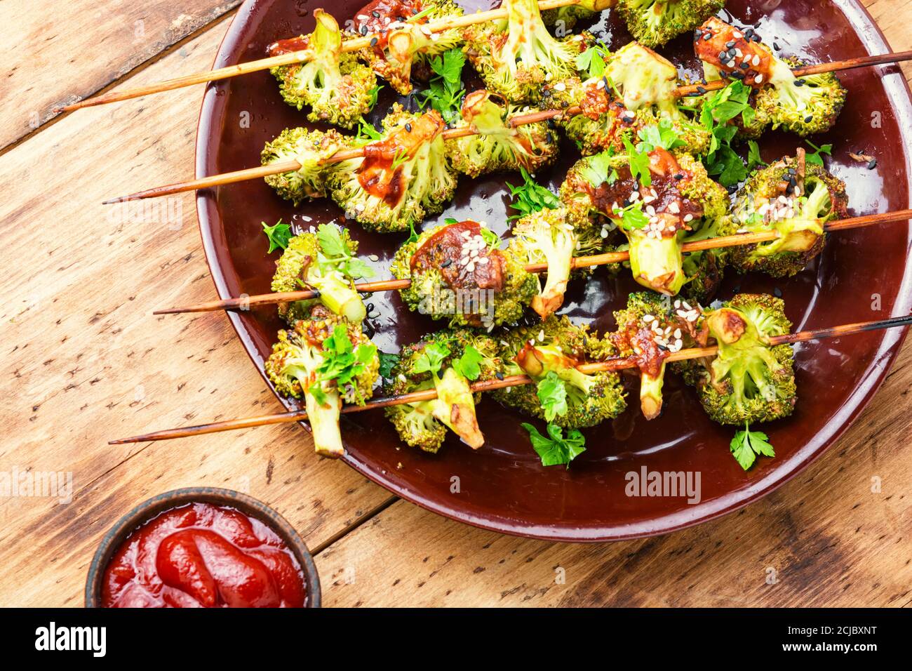 Vegetable kebab from broccoli cabbage on rustic wooden background Stock ...