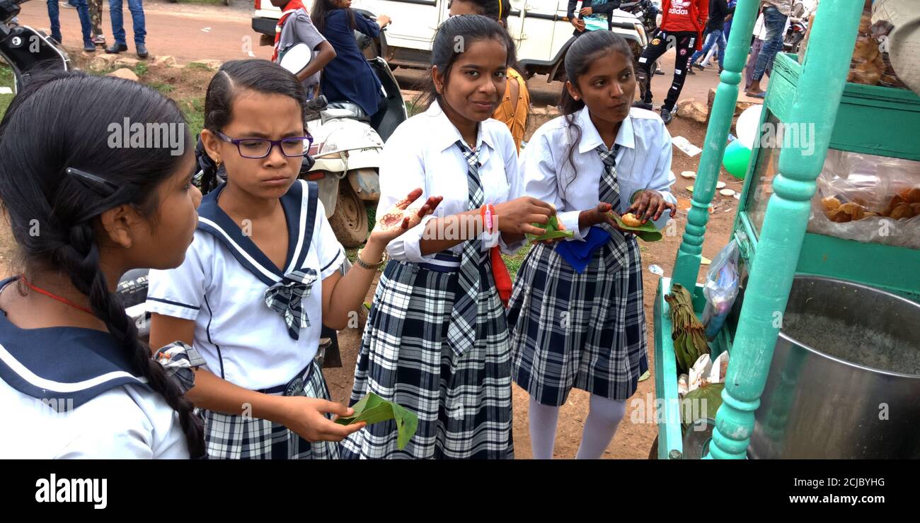DISTRICT KATNI, INDIA - AUGUST 15, 2019: Indian school girls eating ...
