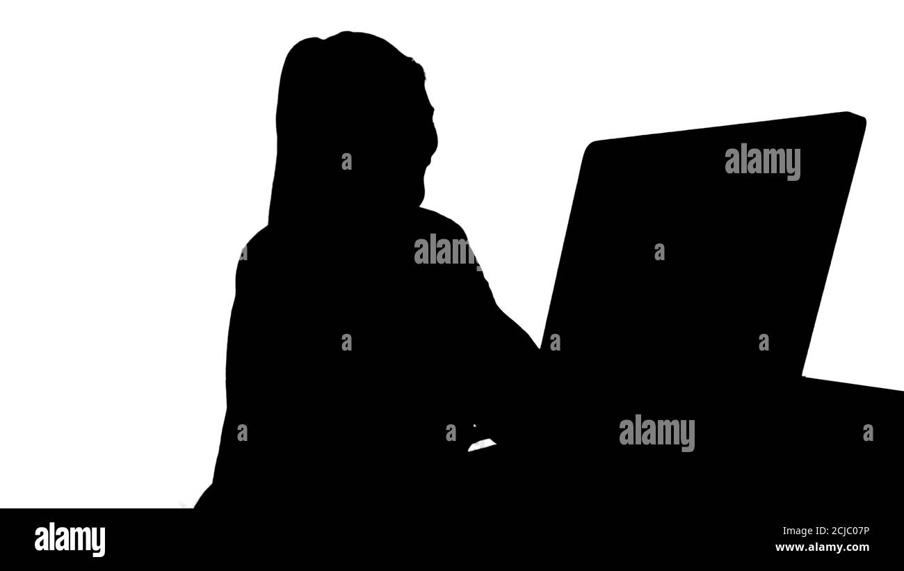 Teen using computer silhouette hi-res stock photography and images - Alamy