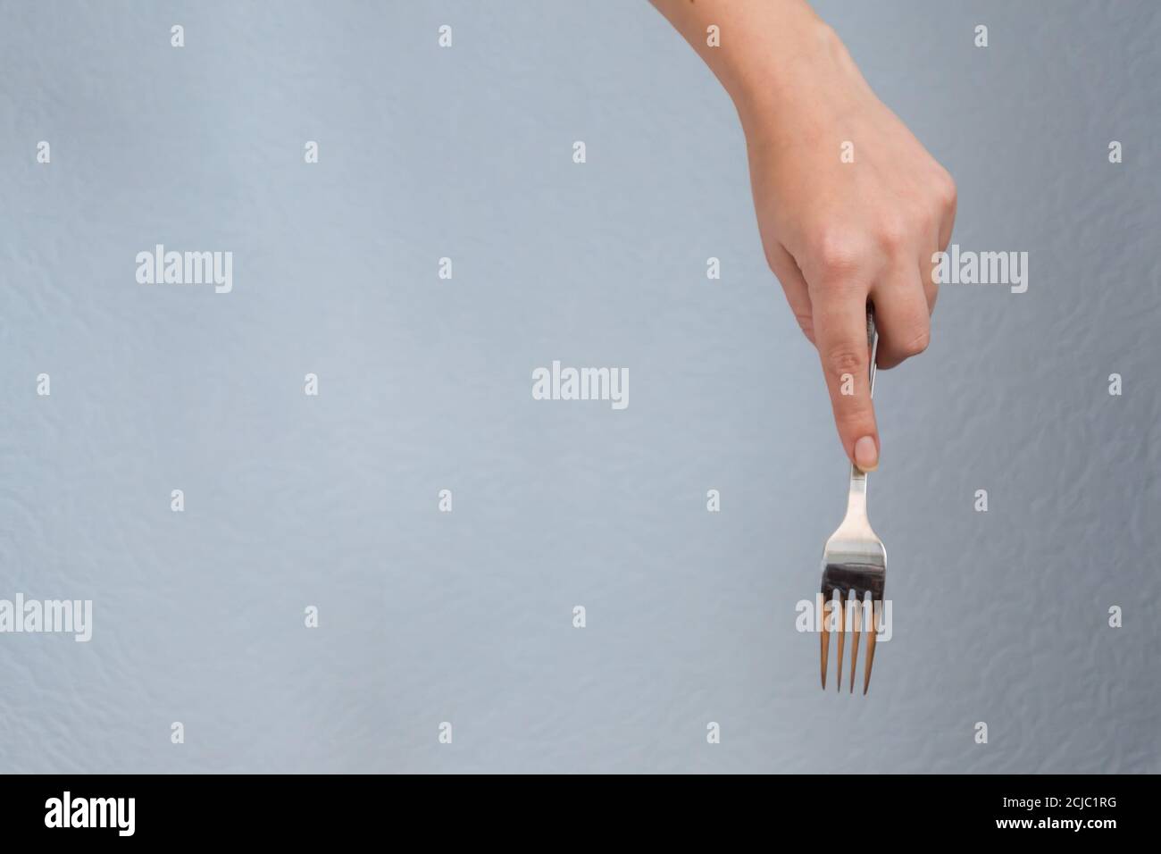 Human hand holding knife fork hi-res stock photography and images - Alamy