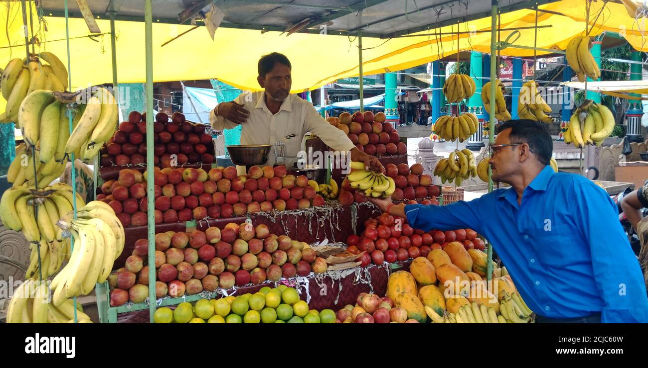 DISTRICT KATNI, INDIA - SEPTEMBER 04, 2019: Indian male fruit vender ...