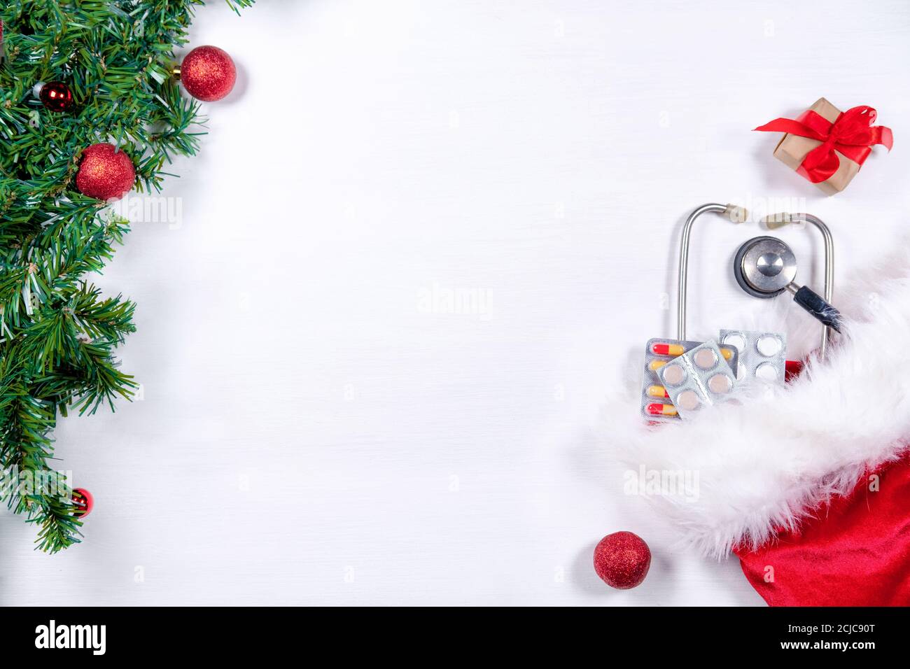 Medical banner with pills, gift present box, stethoscope and Christmas ...