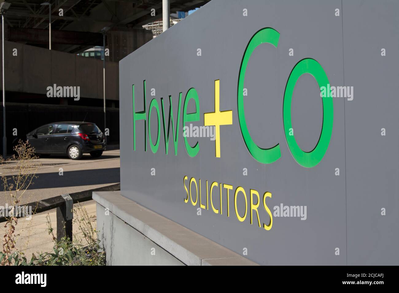 entrance sign with green and yellowing lettering for howe and co ...
