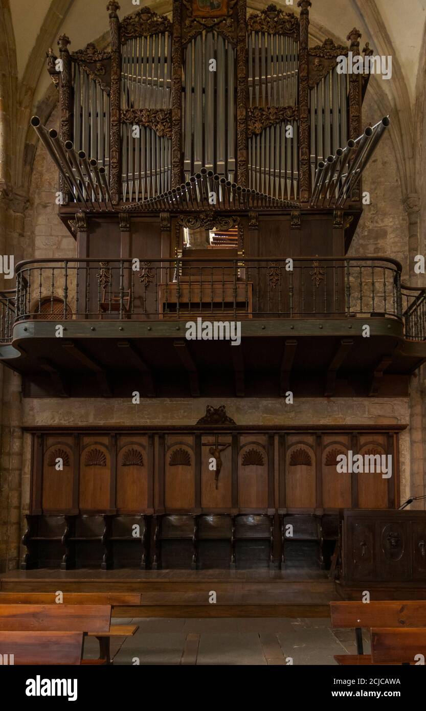 Vertical shot of an old church pipe organ above a church altar Stock ...