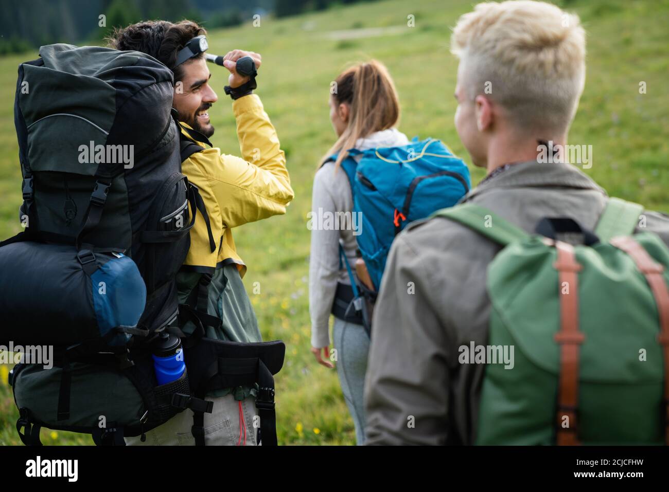 Trekking, hiking, camping and wild life concept. Group of friends ...