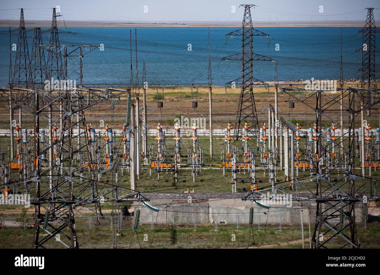 Energy transforming substation and pylons of distributing station. On ...