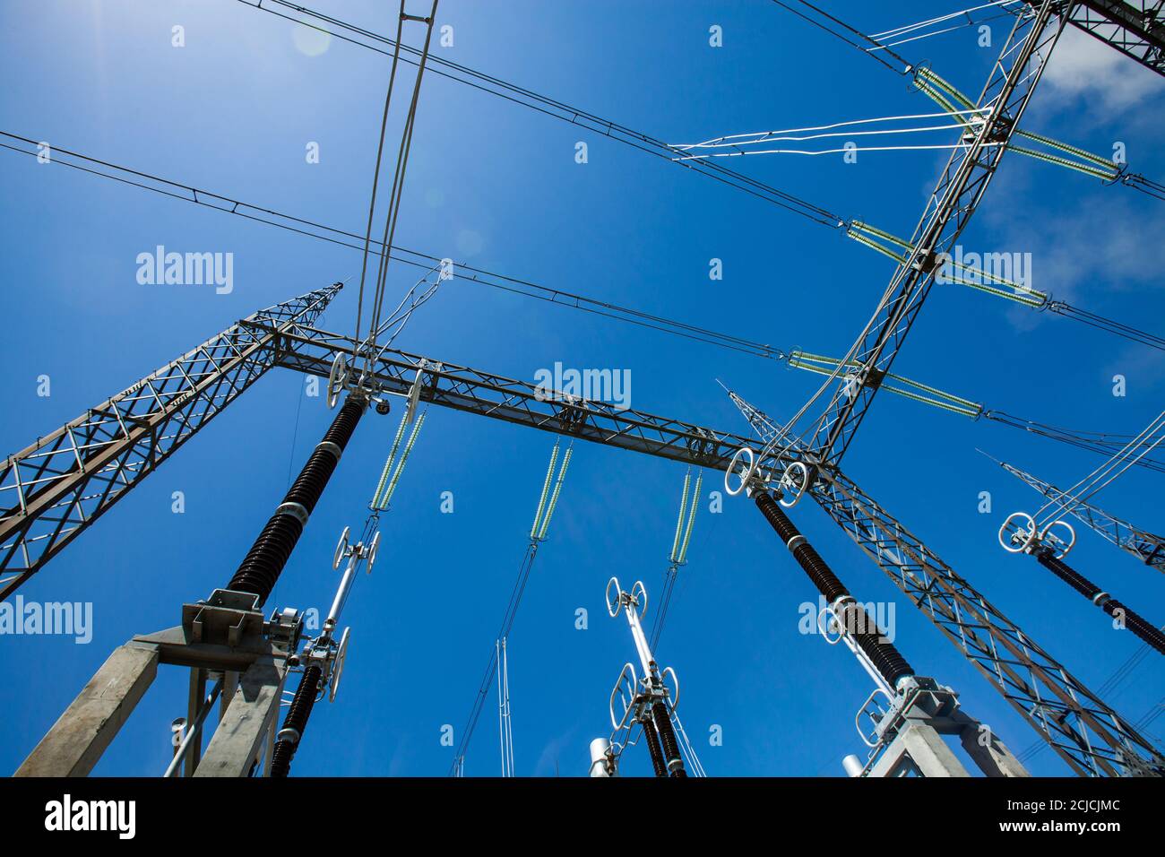 Electrical substation. Electric grids, pylons, wires and insulators ...