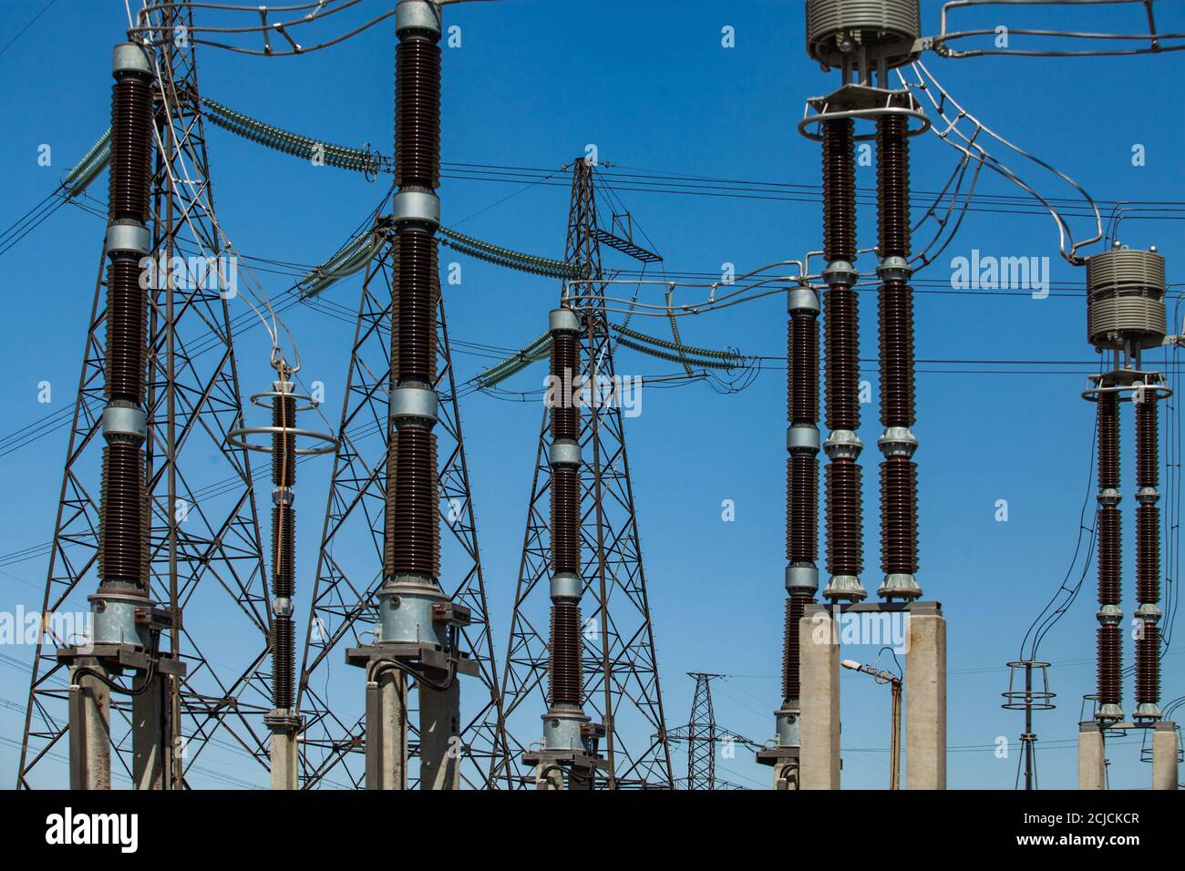 Electrical substation. Electric insulators and pylons (electric mast ...