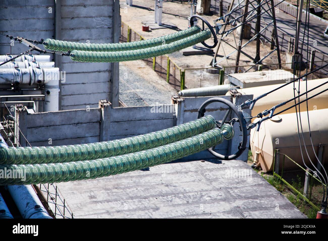 Close-up of glass isolators on electric transformer station. Glass ...