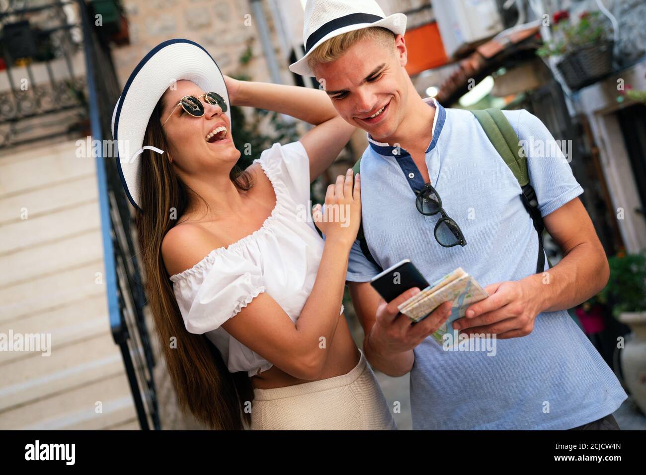 Happy group of friends tourists sightseeing in city on vacation Stock ...
