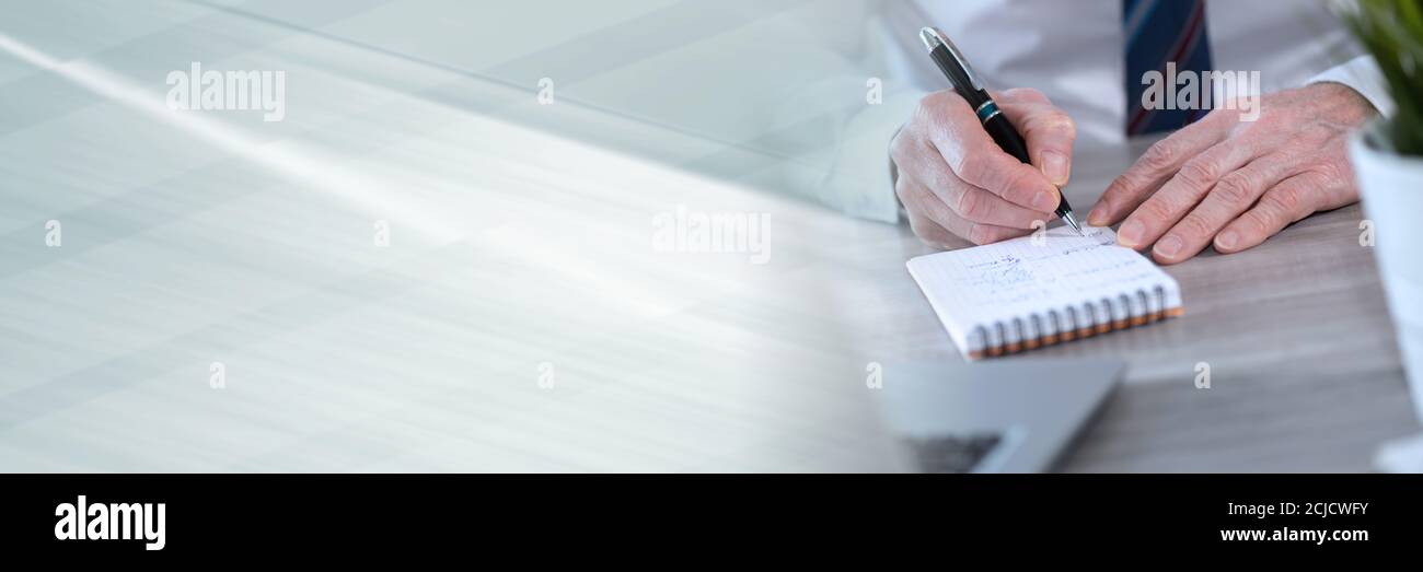 Male hands with pen writing on notepad; panoramic banner Stock Photo ...