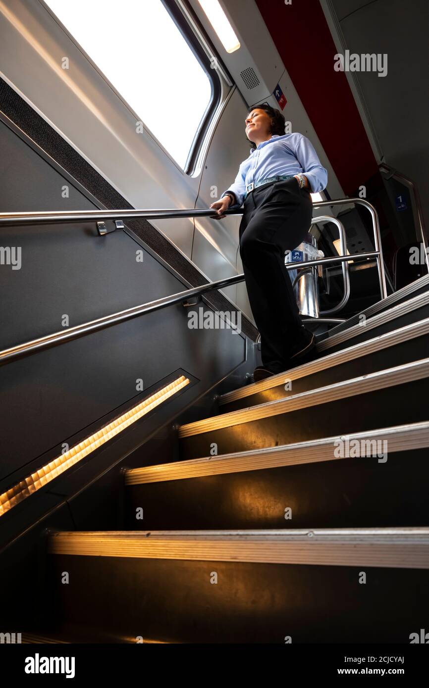 Woman Walking Down on a Staircase in First Class Train in Switzerland ...