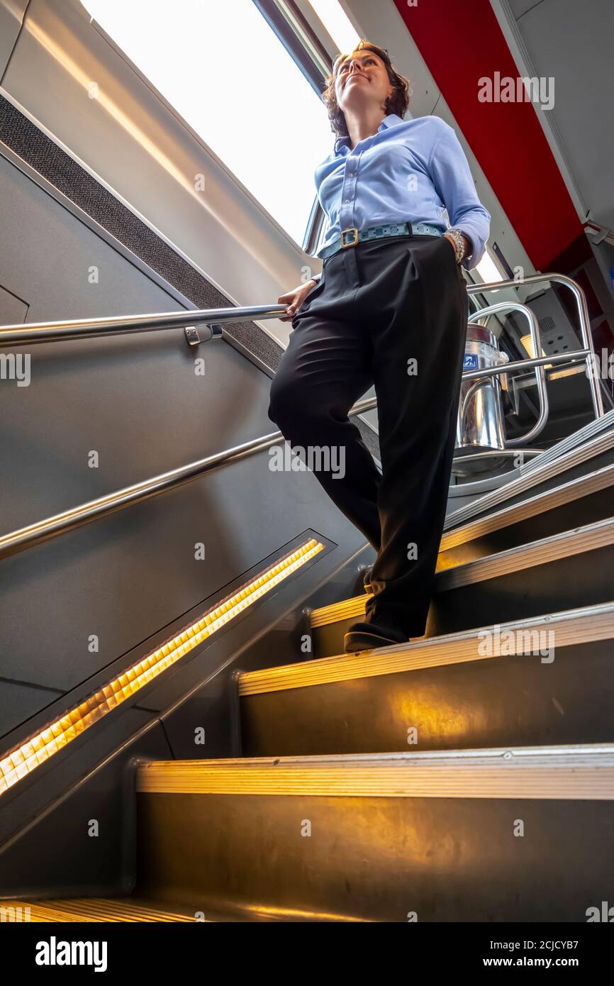 Woman Walking Down on a Staircase in First Class Train in Switzerland ...