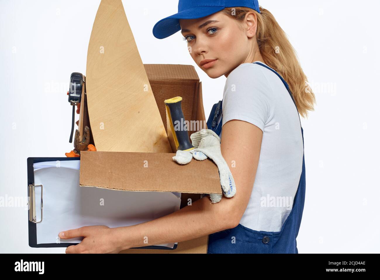 Woman working with box in hands of tools delivery service light ...