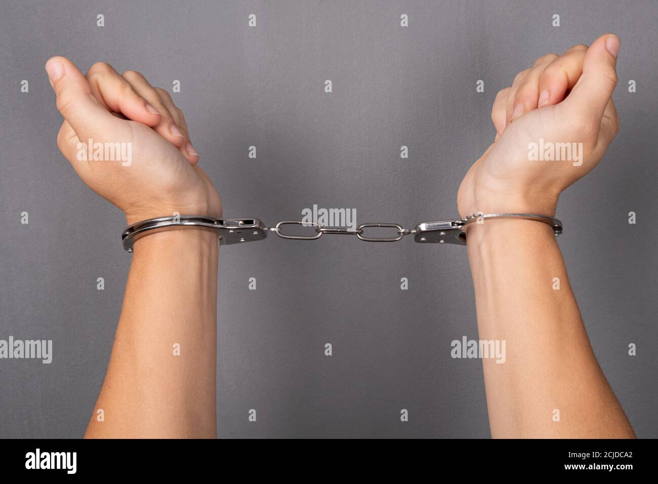 handcuffed hands, arrest, punishment for a crime Stock Photo - Alamy