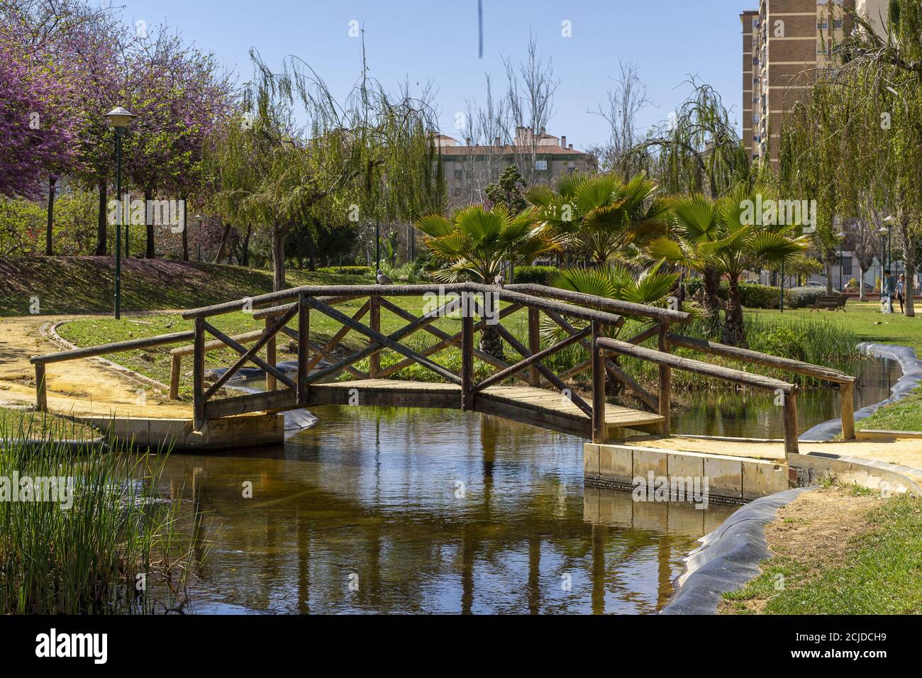 Wooden bridge over a river in a park in Malaga, Paisaje Stock Photo - Alamy