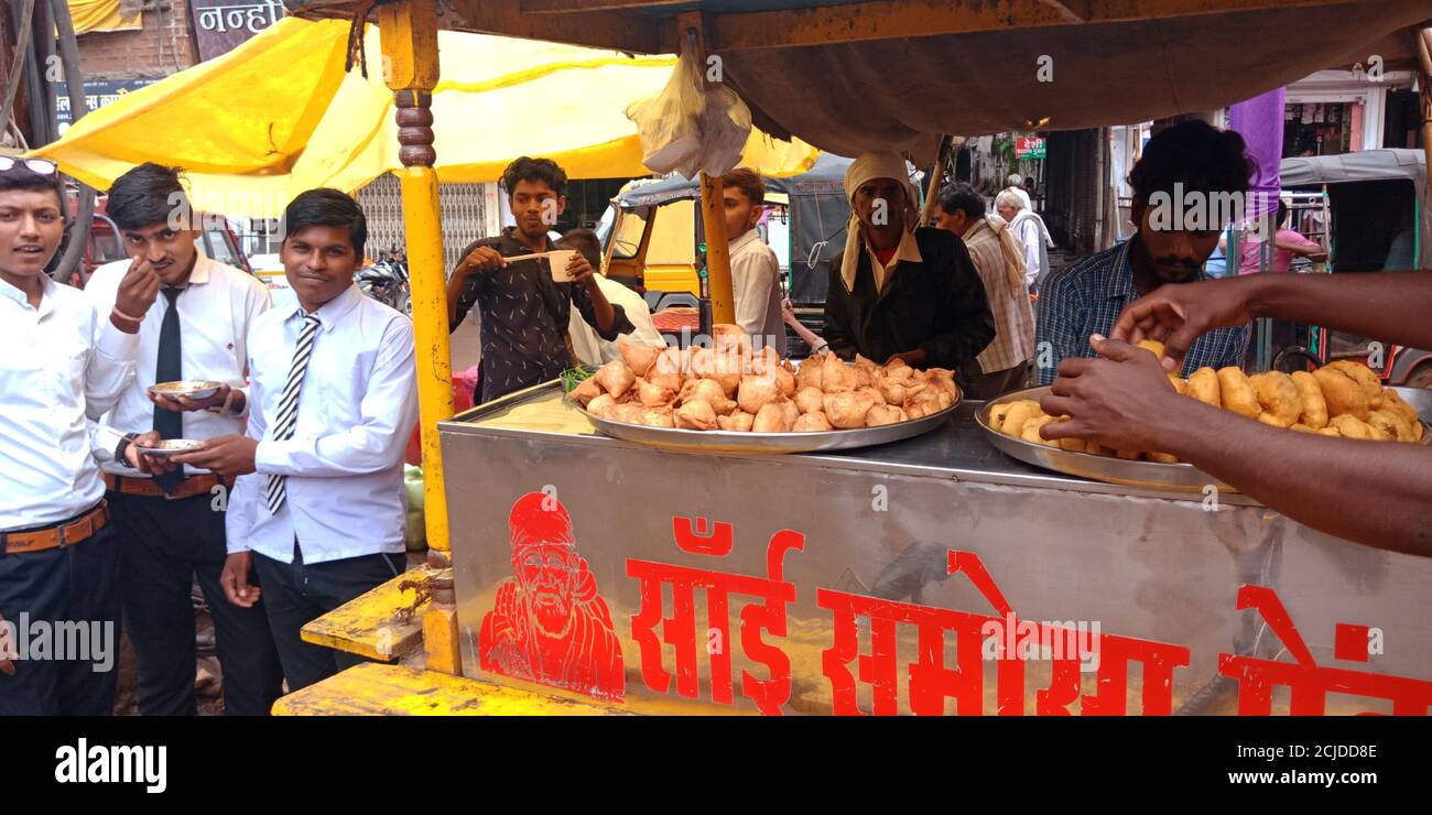 DISTRICT KATNI, INDIA - SEPTEMBER 24, 2019: an indian having fresh vada ...