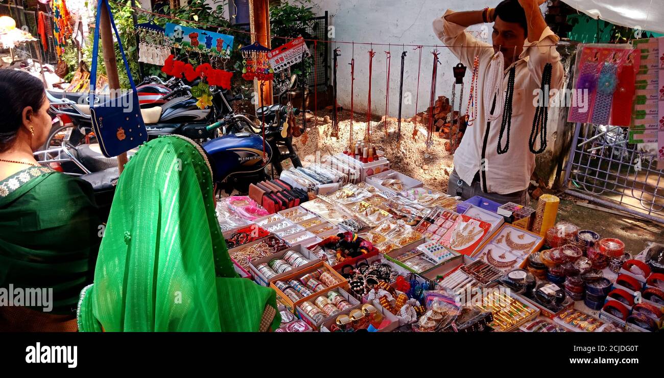 DISTRICT KATNI, INDIA - OCTOBER 13, 2019: An indian village lady buying ...